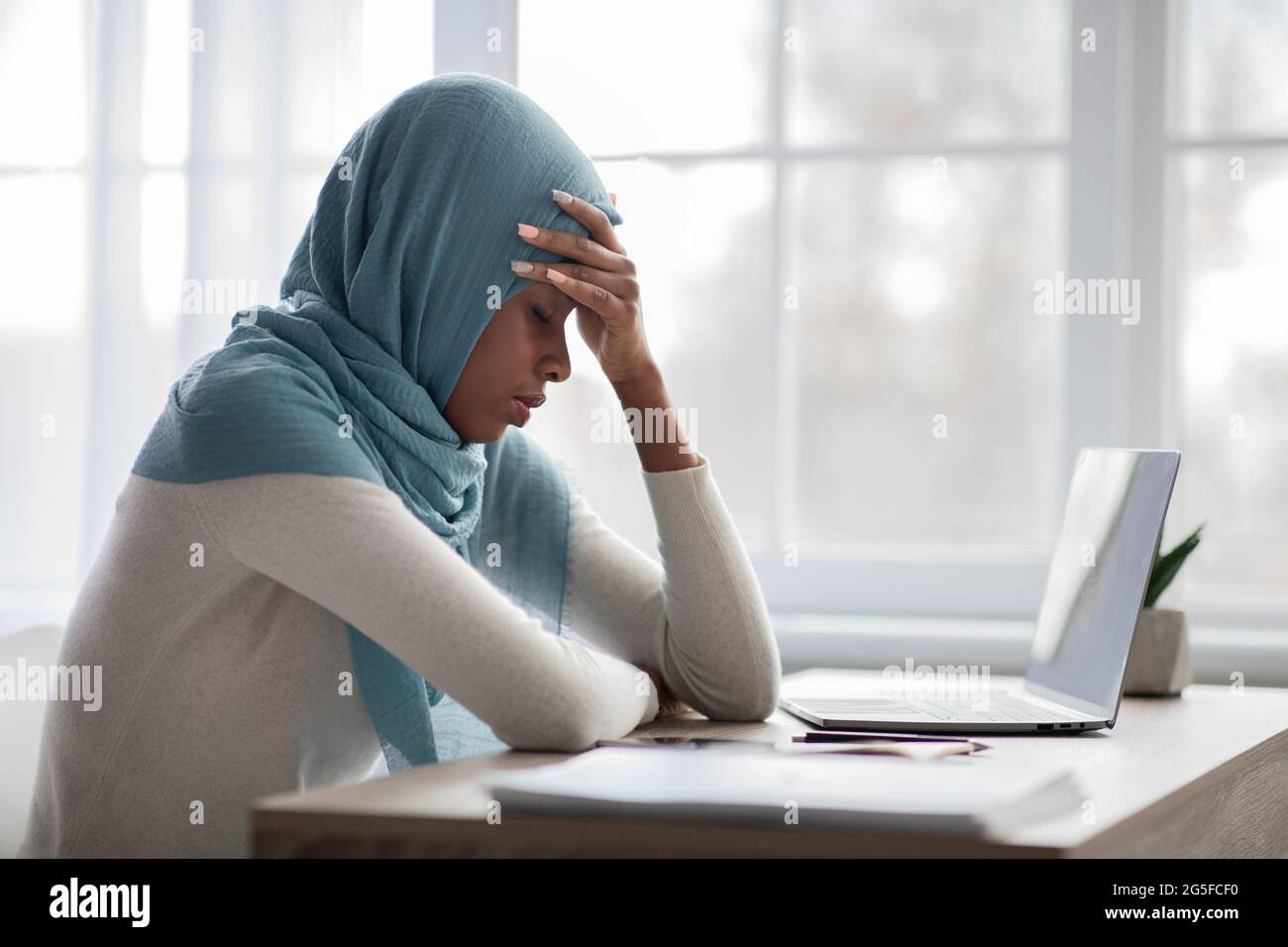 Working Stress. Portrait Of Upset Black Islamic Woman In Hijab Sitting ...