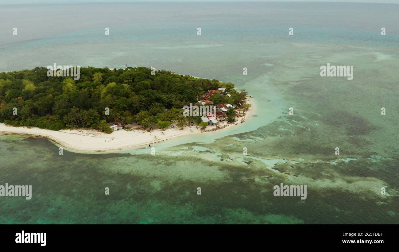 Beautiful beach on tropical island surrounded by coral reef, top view ...