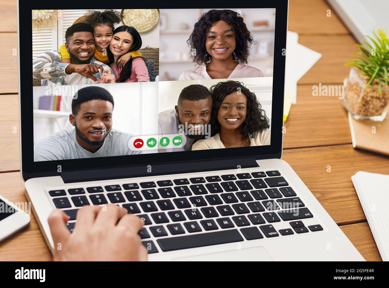 Extended black family having group video call to their relative on ...