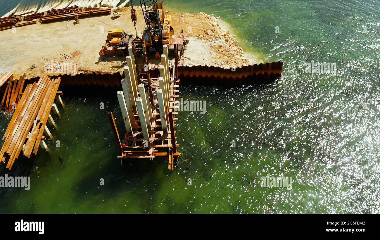 Pile driving machine in construction site.The bridge under construction ...