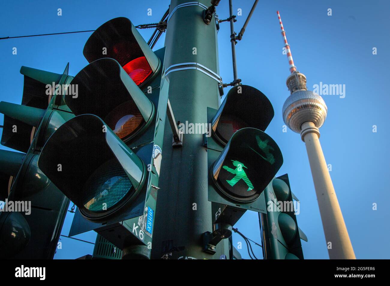 A classic green man crossing signal at a traffic light at a pedestrian ...