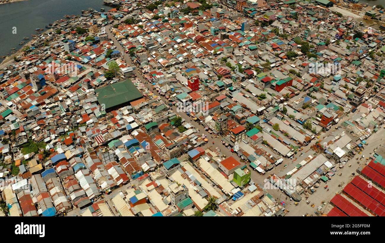 Poor area in the slums of Manila with density houses and streets from ...