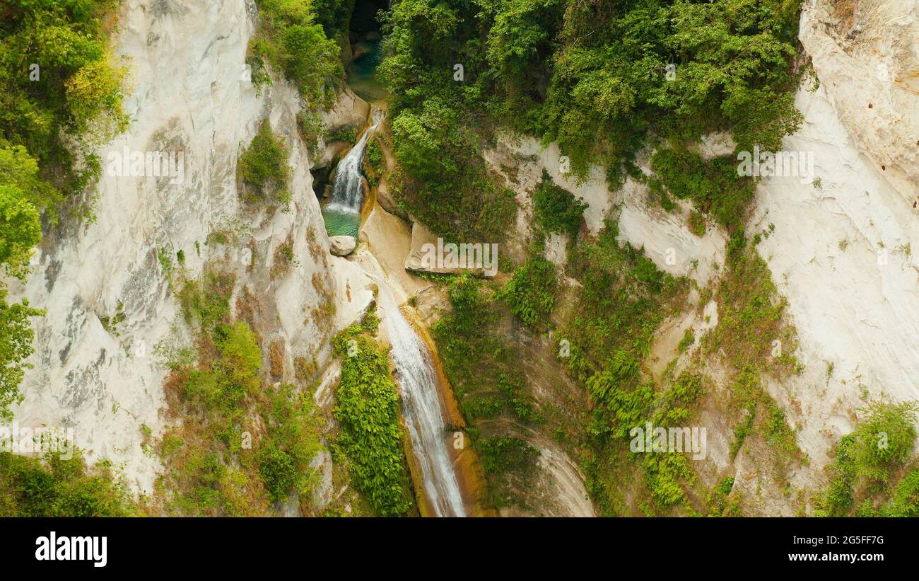 Aerial view of Dao waterfalls in a mountain gorge in the tropical jungle, Philippines, Cebu ...