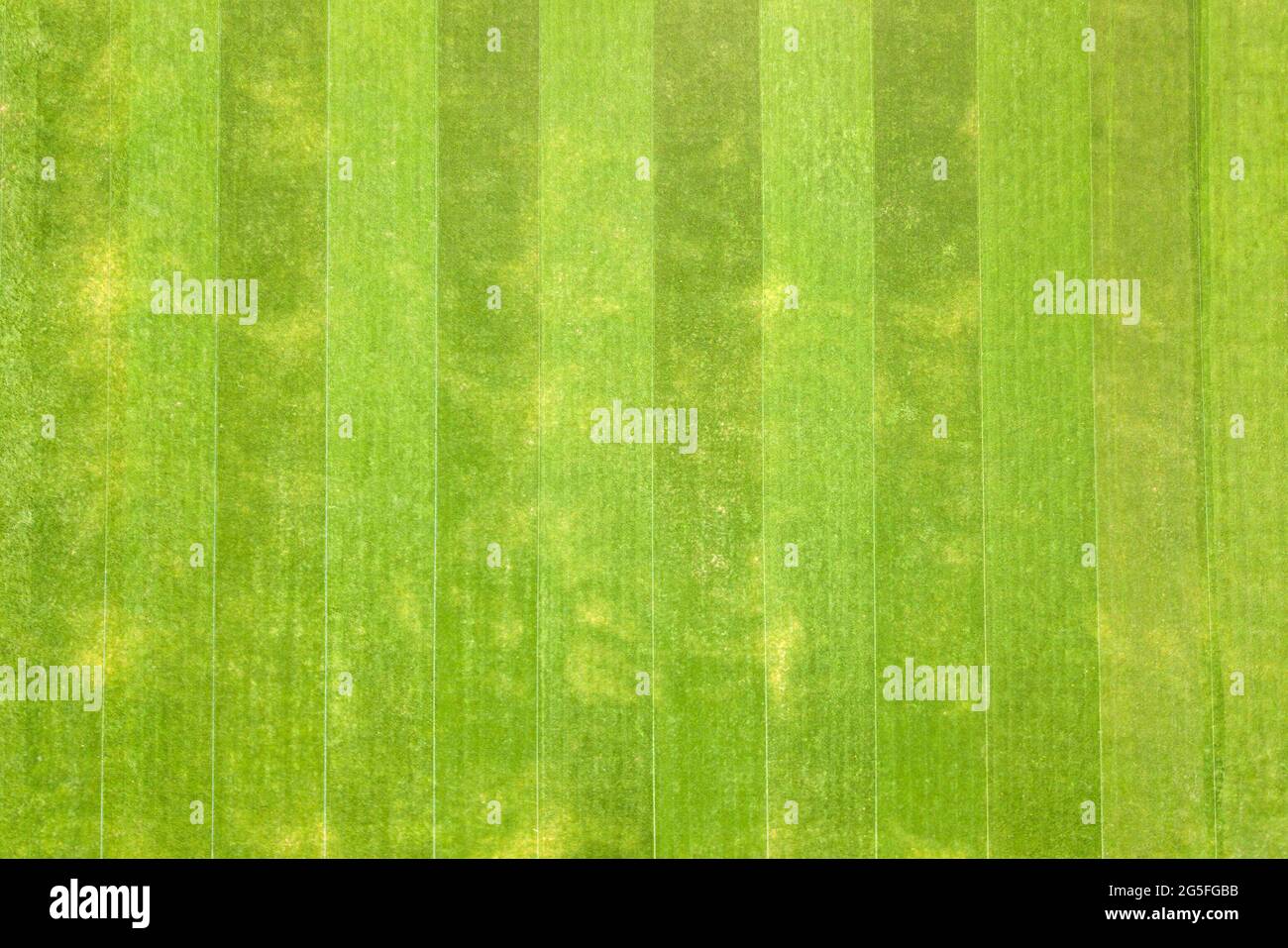 Close up aerial view of surface of green freshly cut grass on football ...