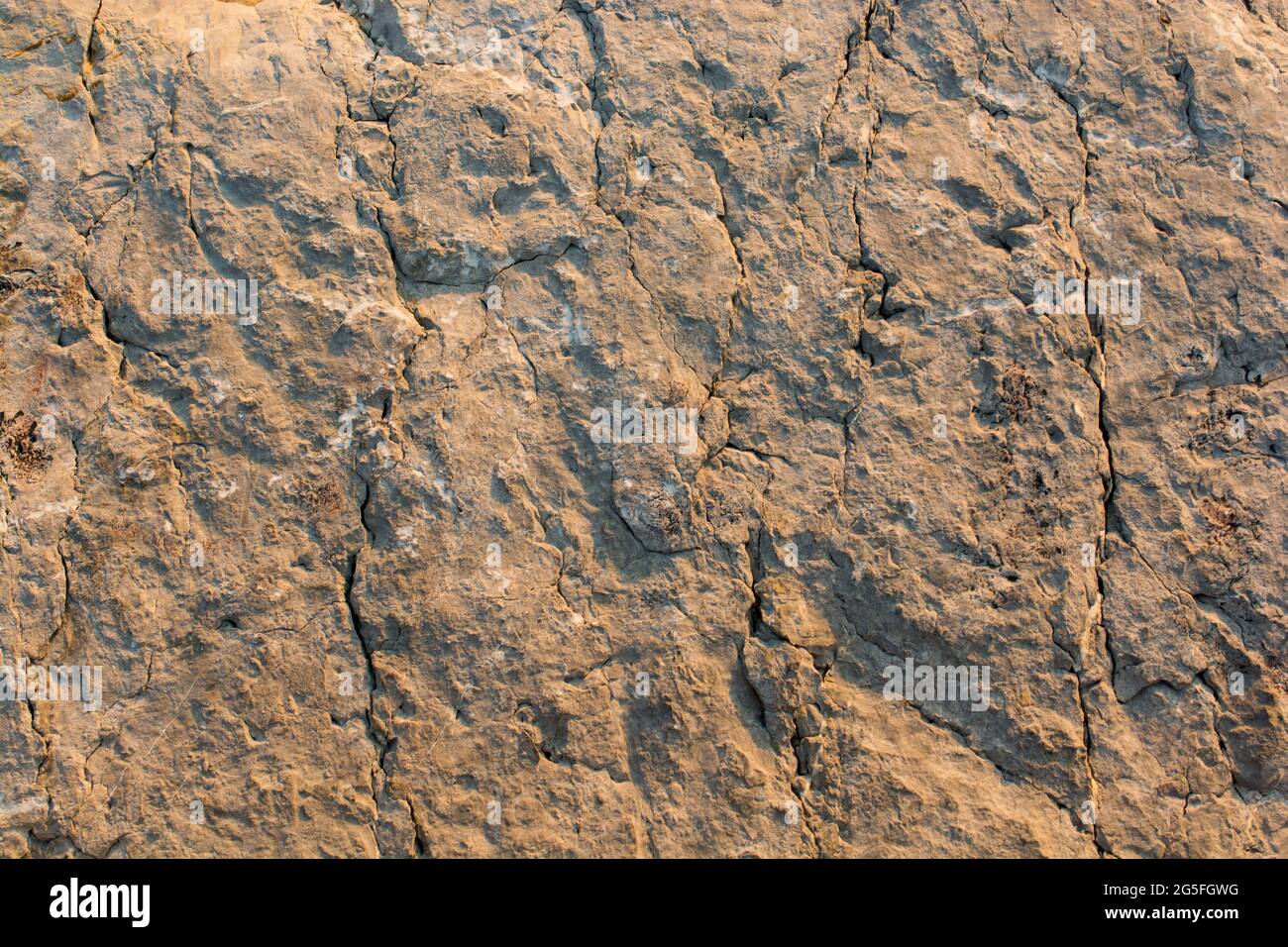 A horizontal background of a natural cracked rock formation Stock Photo ...