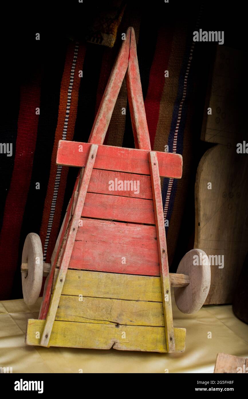 A closeup shot of a small colored old wooden cart Stock Photo - Alamy