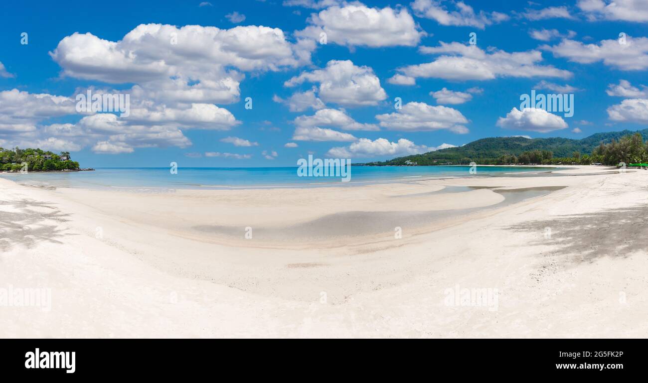 tropical paradise beach with blue sky and mountain panorama background ...