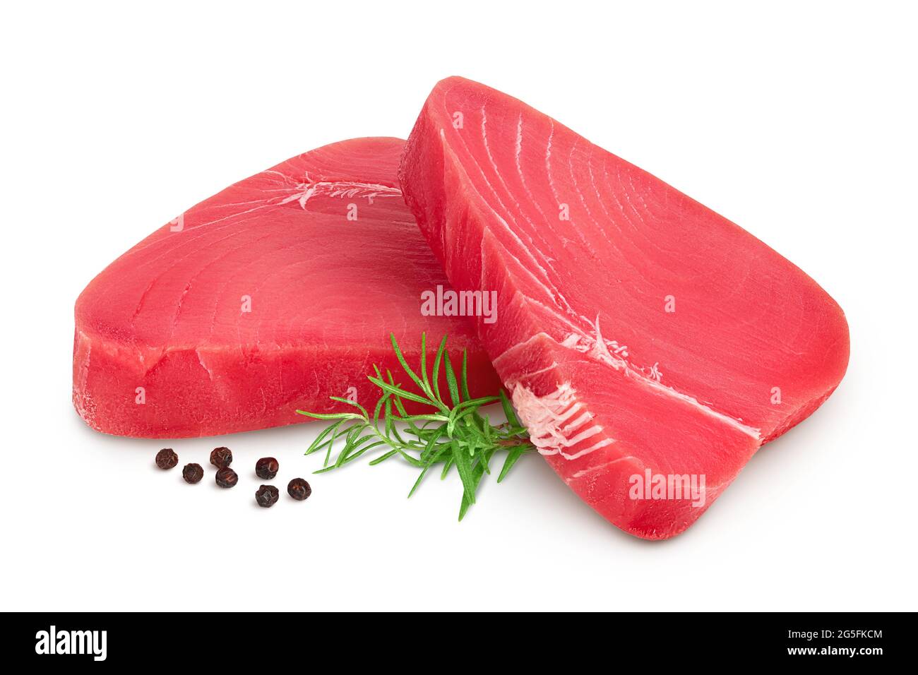 Fresh tuna fish fillet steak with rosemary and peppercorns isolated on ...