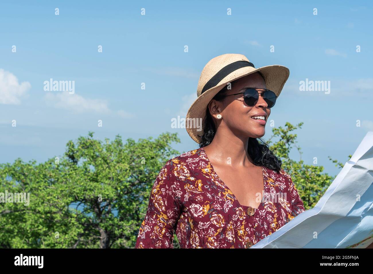 African woman exploring the map while in the mountains Stock Photo - Alamy