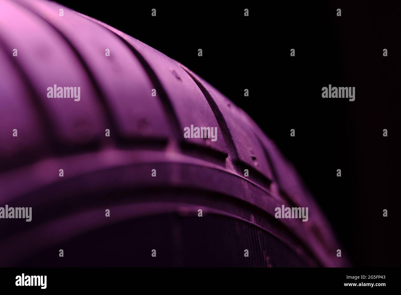 Abstract macro photography. close up tire texture pattern with violet ...