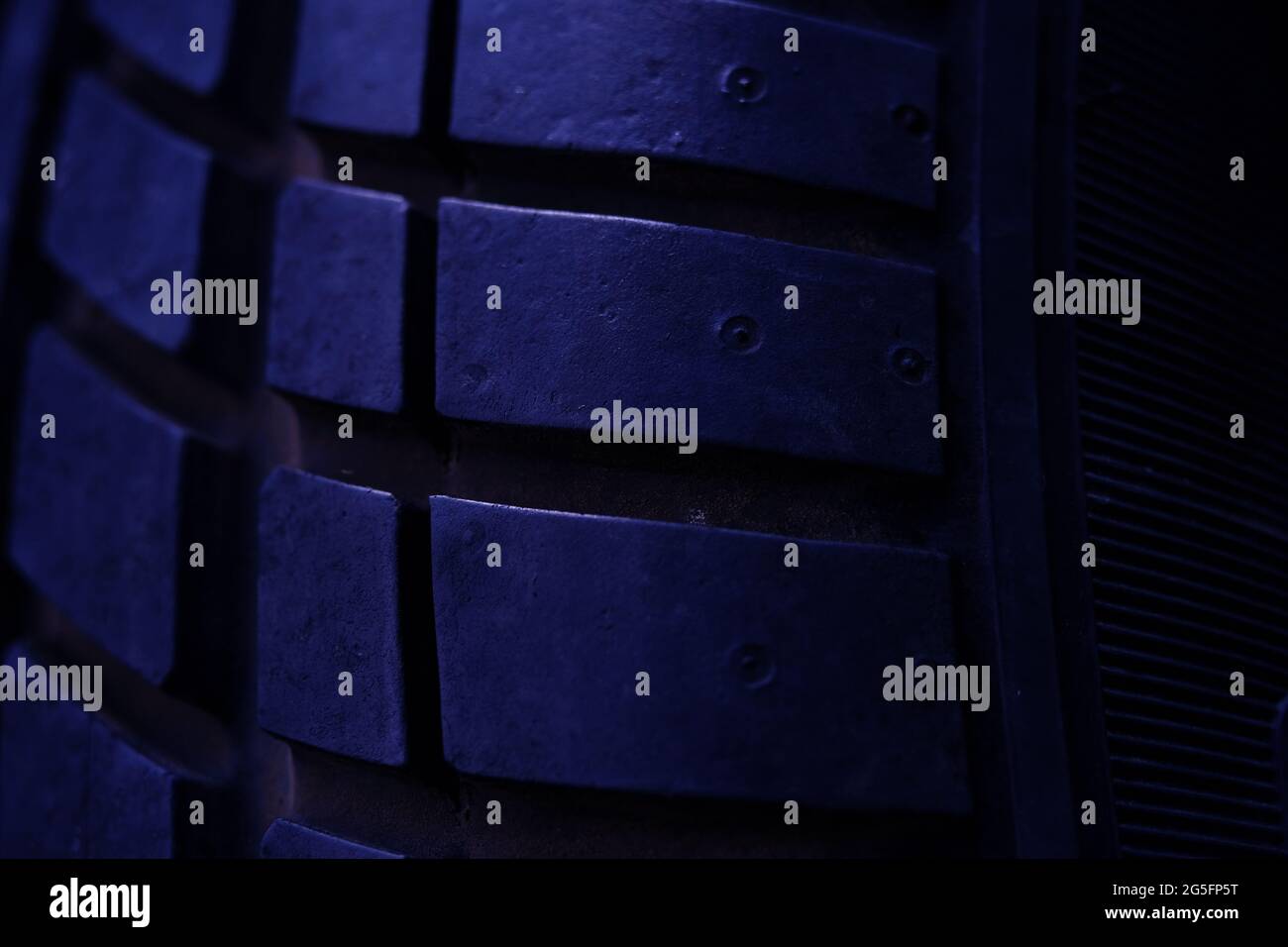 Abstract macro photography. Close up tire texture pattern with purple ...