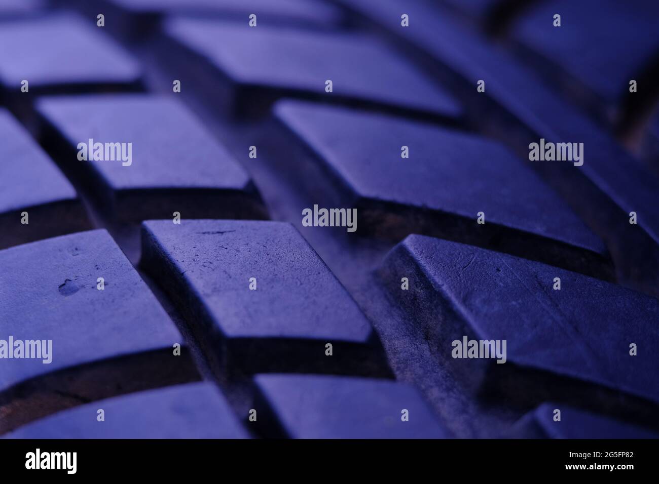 Abstract macro photography. Close up tire texture pattern with purple ...