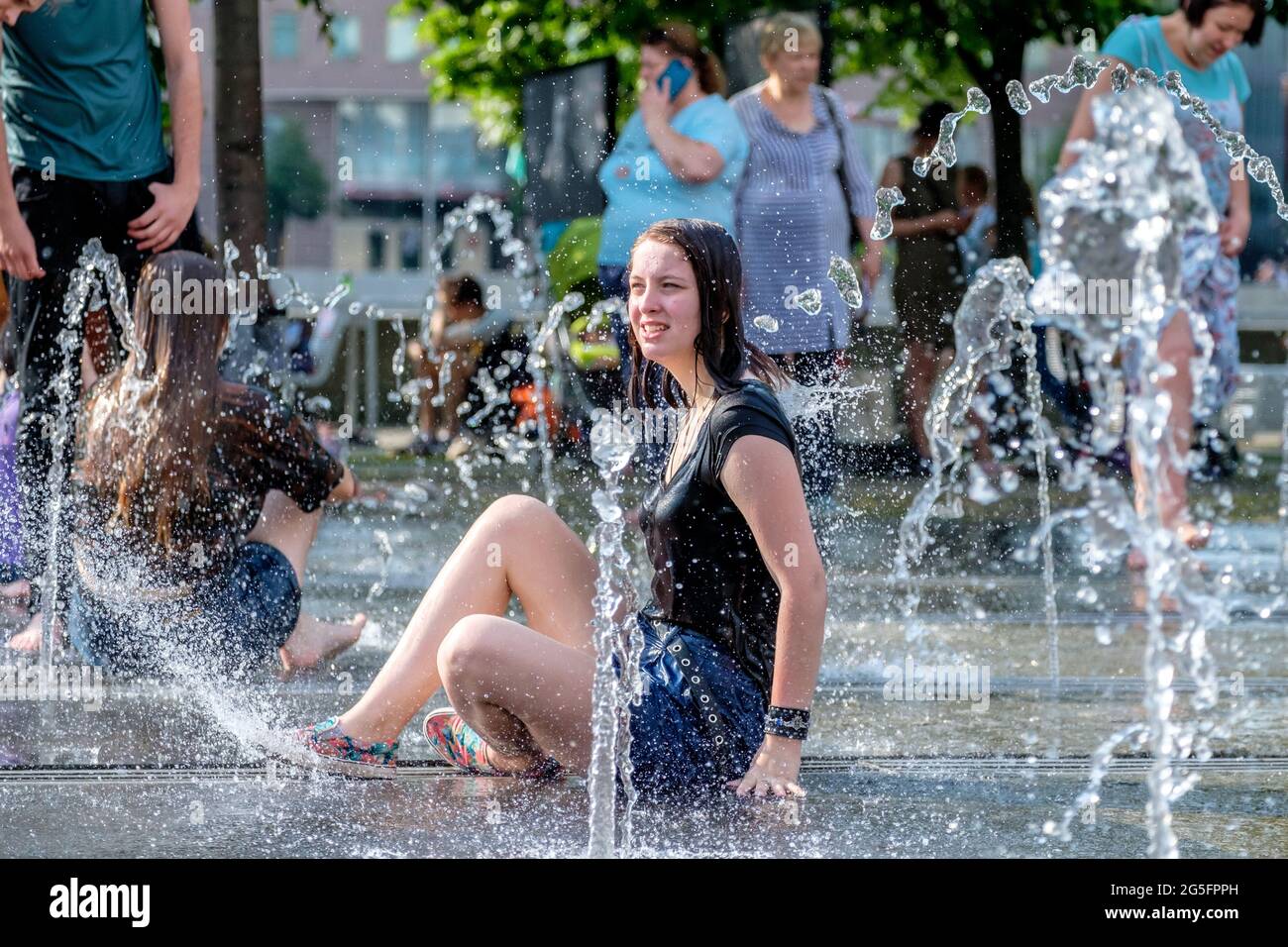 Woman clothes on water spray hi-res stock photography and images - Alamy