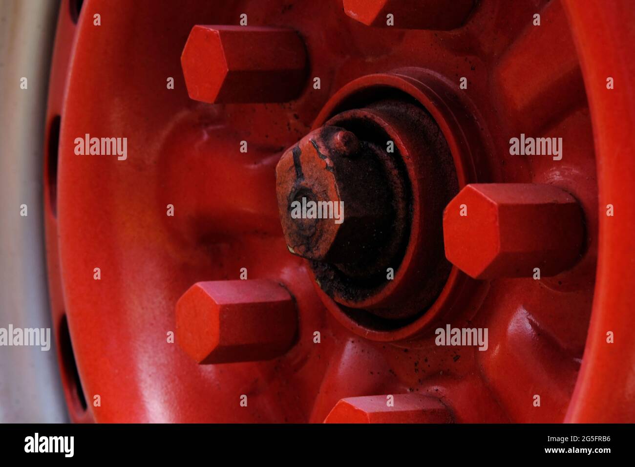 Close up red alloy wheel. Abstract macro photography Stock Photo - Alamy