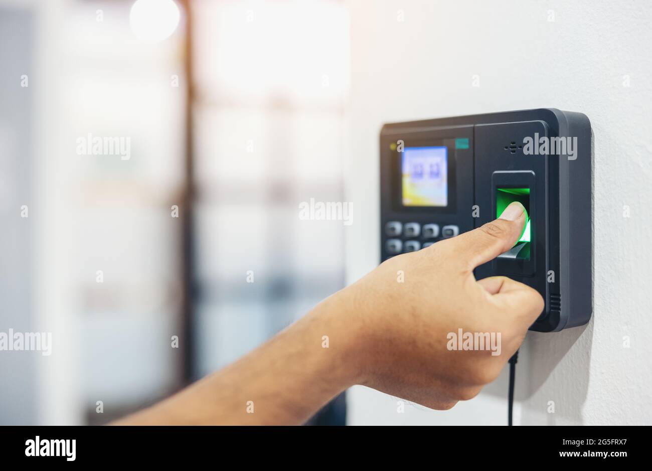 Finger print scan, Male employees press sensors to record company ...