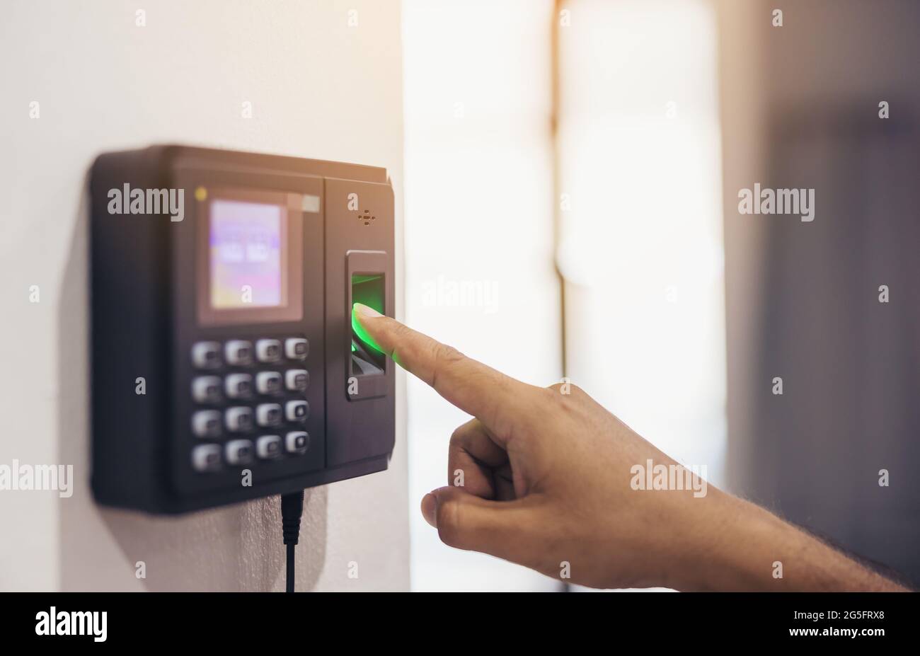 Finger print scan, Male employees press sensors to record company ...