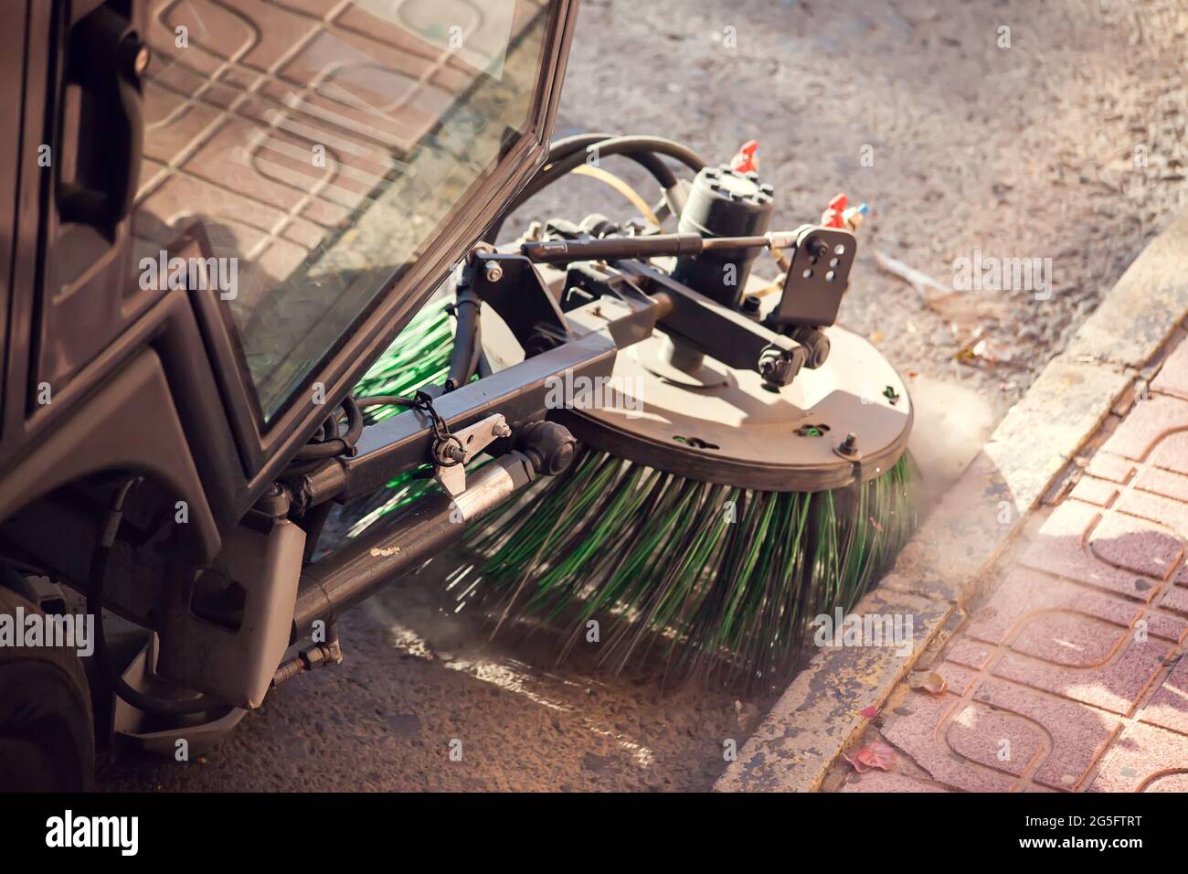 Street cleaning machine with truck brushes. Close up shot Stock Photo ...