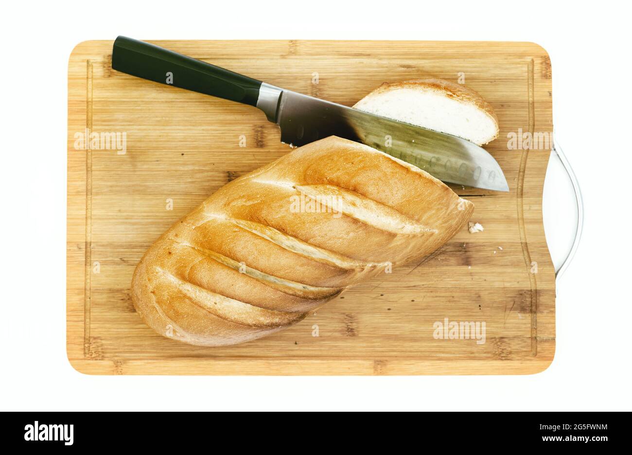 cutting white bread loaf on hardboard and chefs knife Stock Photo - Alamy
