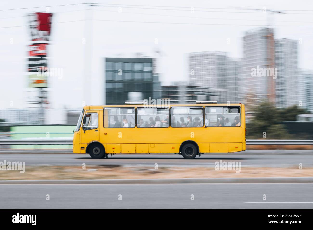 Ukraine, Kyiv - 29 April 2021: Yellow Municipal Bus Marshrutka moving ...