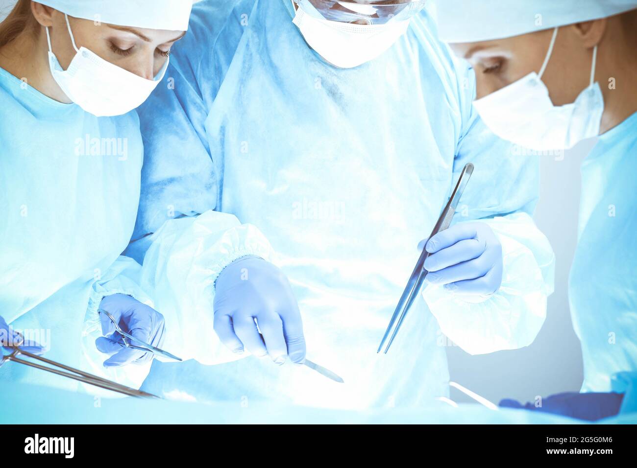 A group of surgeons is operating at the hospital. Health care concept ...