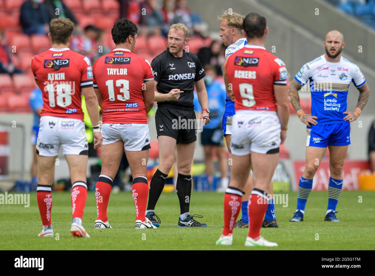 Referee Robert Hicks speaks to Elijah Taylor (13) of Salford Red Devils ...