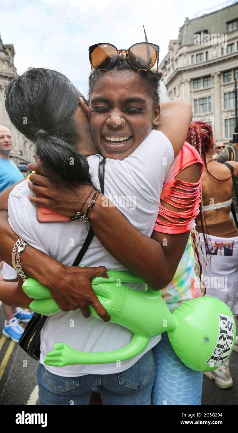London, UK. 26th June, 2021. Protesters seen hugging each other at ...