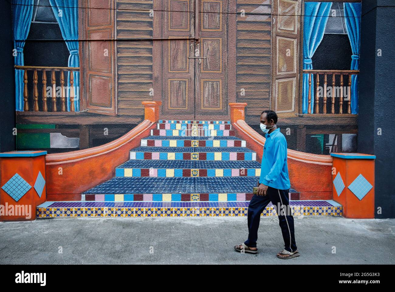 Kuala Lumpur, Malaysia. 27th June, 2021. A man wearing a face mask as a ...