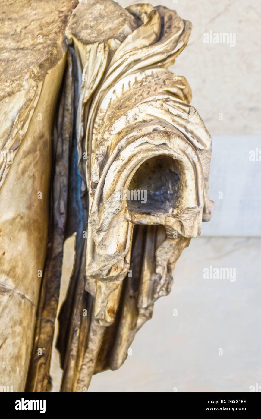 Close-up detail on ancient Greek statue of arm with a hole where a hand ...