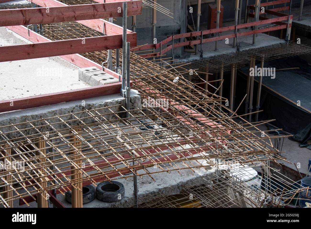 close-up of the remaining rebar at a demolished cement ceiling with ...