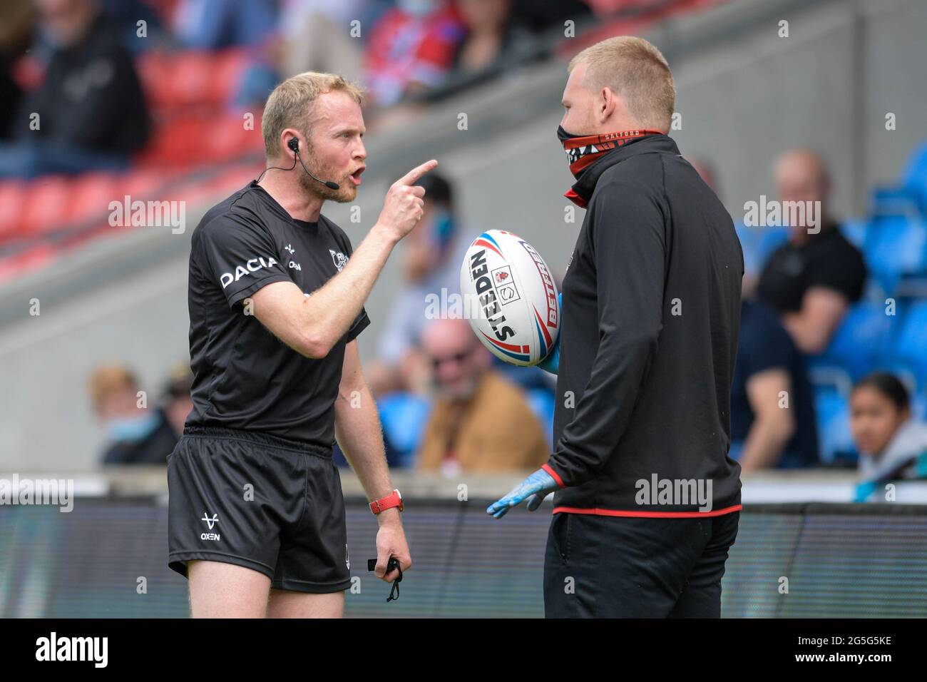 Referee Robert Hicks speaks directly to a Salford Red Devils ballboy ...