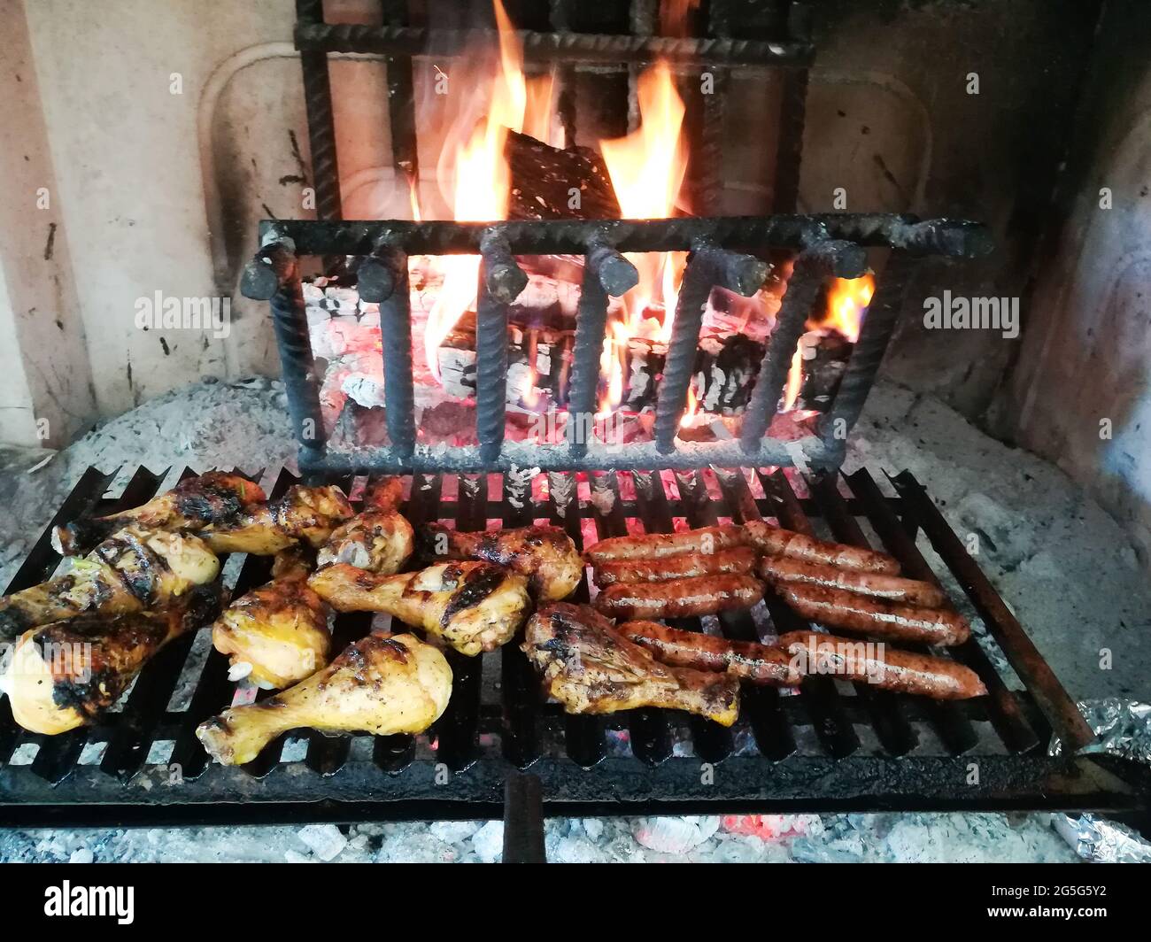 Grilled meat cooked on fireplace Stock Photo - Alamy
