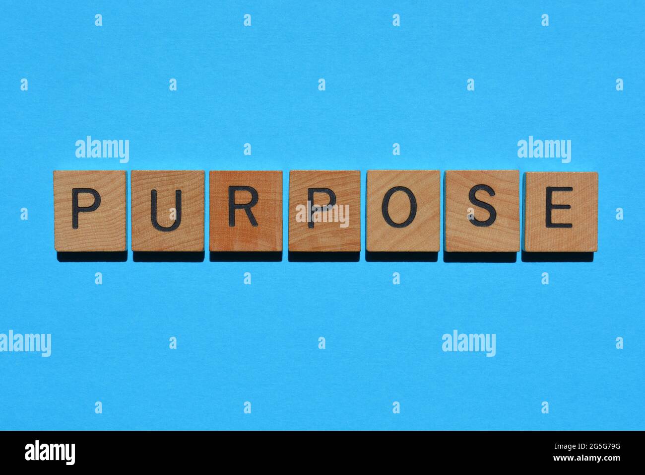 Purpose, word in wooden alphabet letters isolated on bright blue ...
