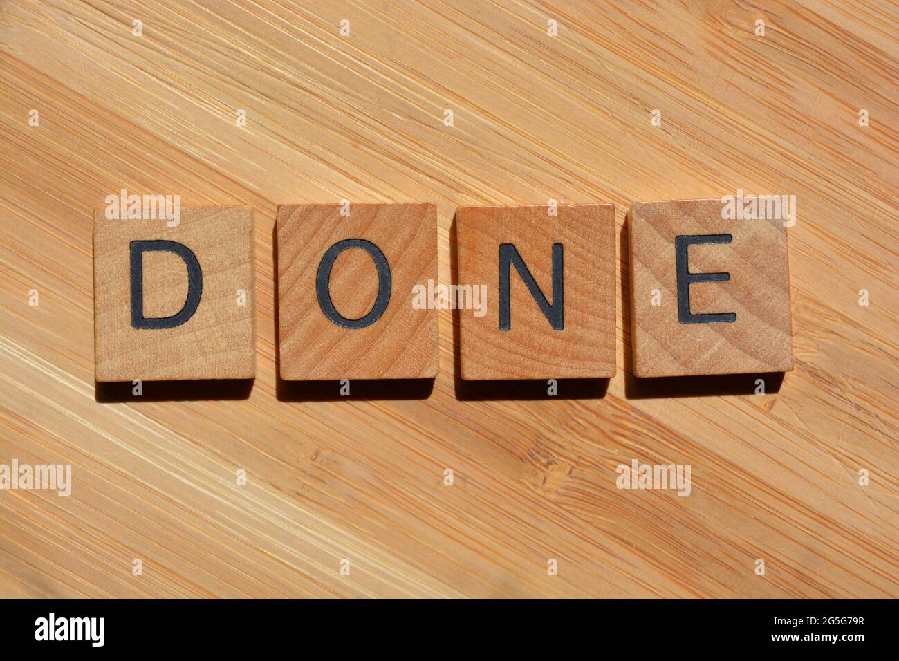 Done, word in wooden alphabet letters isolated on background Stock ...