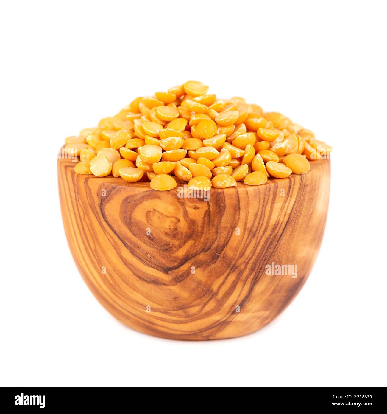 Dry yellow split peas in olive bowl, isolated on white background ...