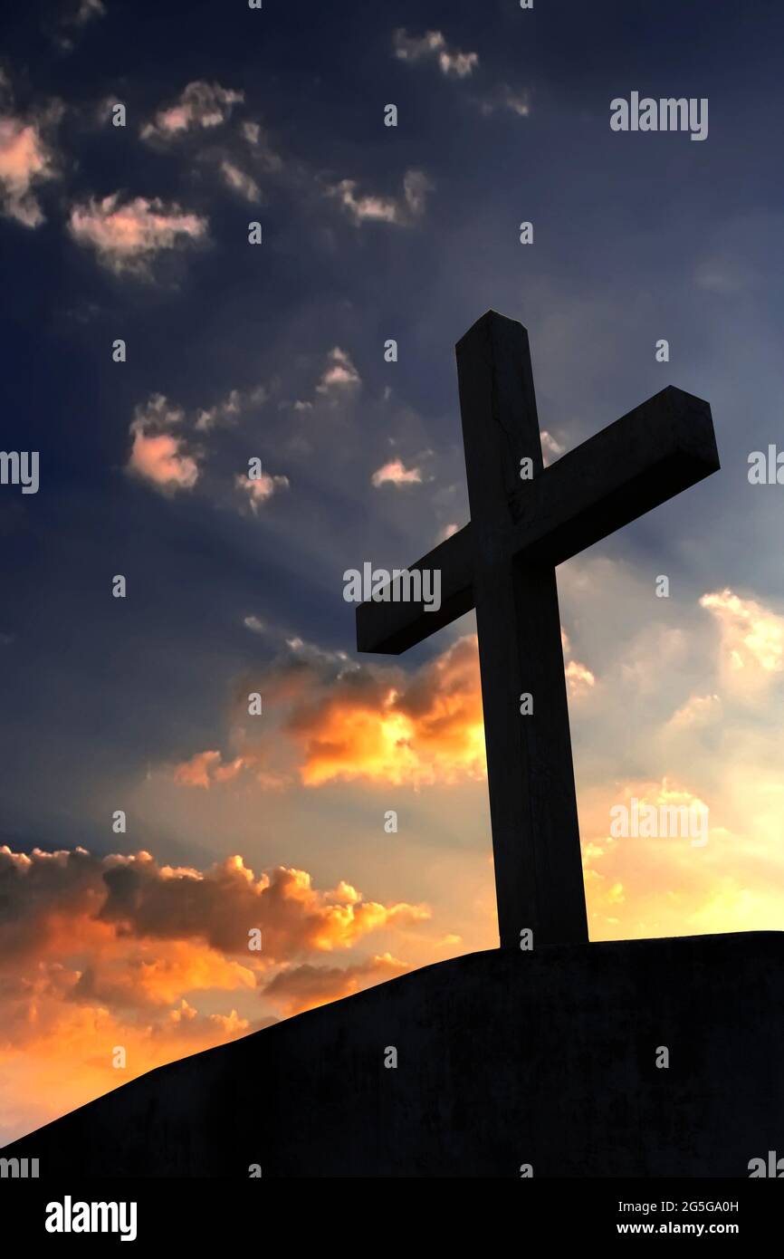 Cross on dark sky - religious Stock Photo - Alamy