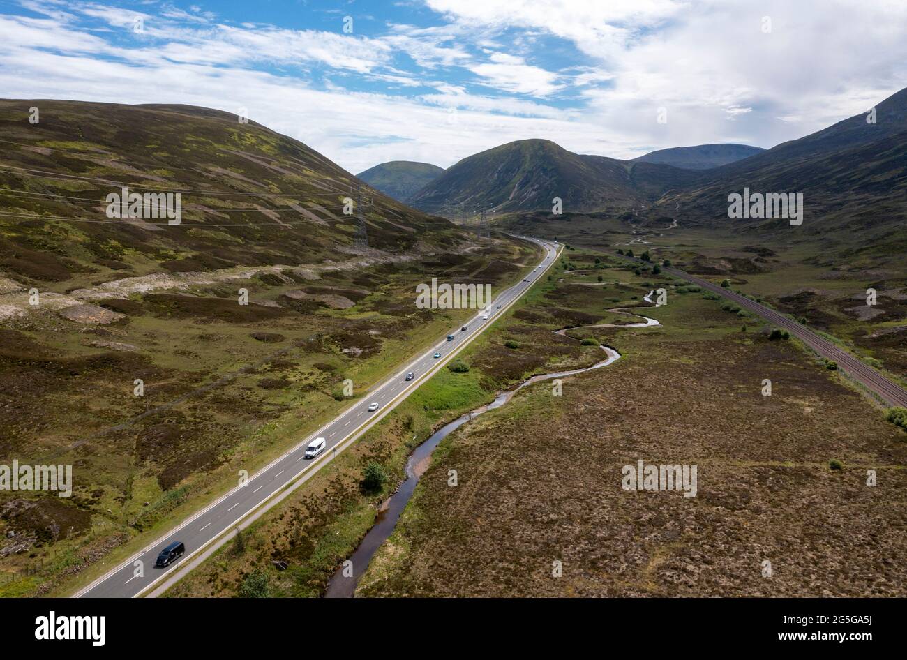 Aerial view of the A9 trunk road and main highland railway line at the ...