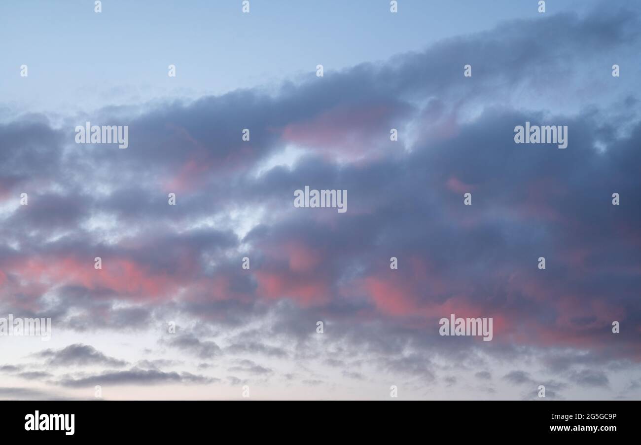 Evening sky with pastel-colored clouds Stock Photo - Alamy