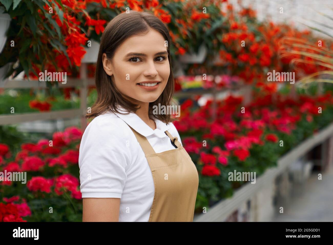 Female florist in uniform hi-res stock photography and images - Alamy