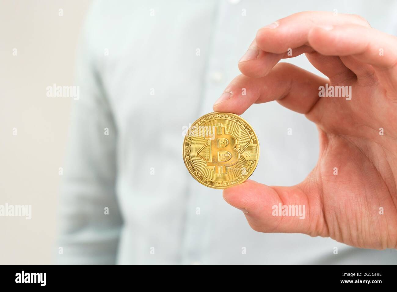 Bitcoin in hand close hi-res stock photography and images - Alamy