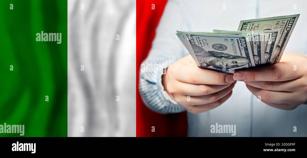 Colorful waving italian national flag and american dollar money in ...