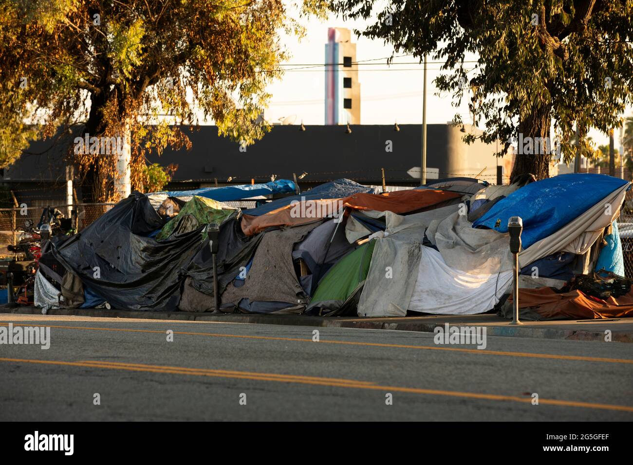 A homeless encampment sits on a street in Downtown Los Angeles ...