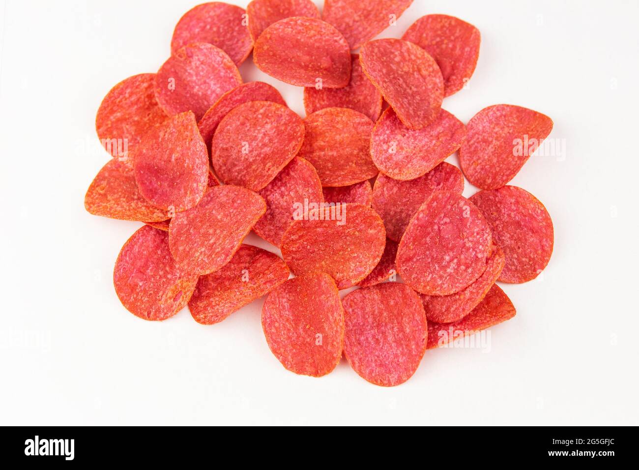 Red chips with hot pepper taste on a white background. Beer snack Stock ...