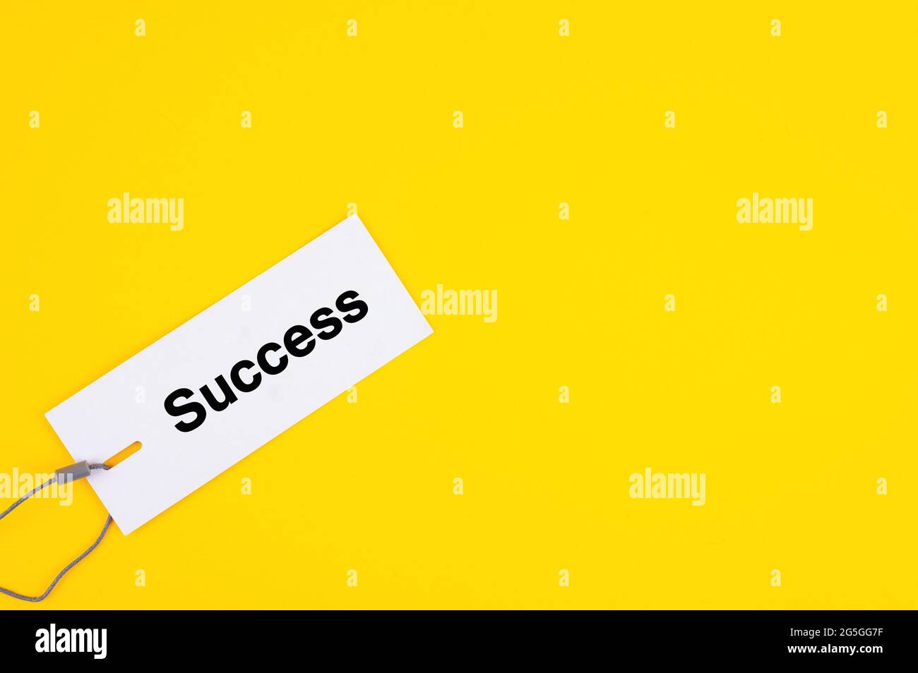 A top view of a label with "success" text on a yellow background Stock ...