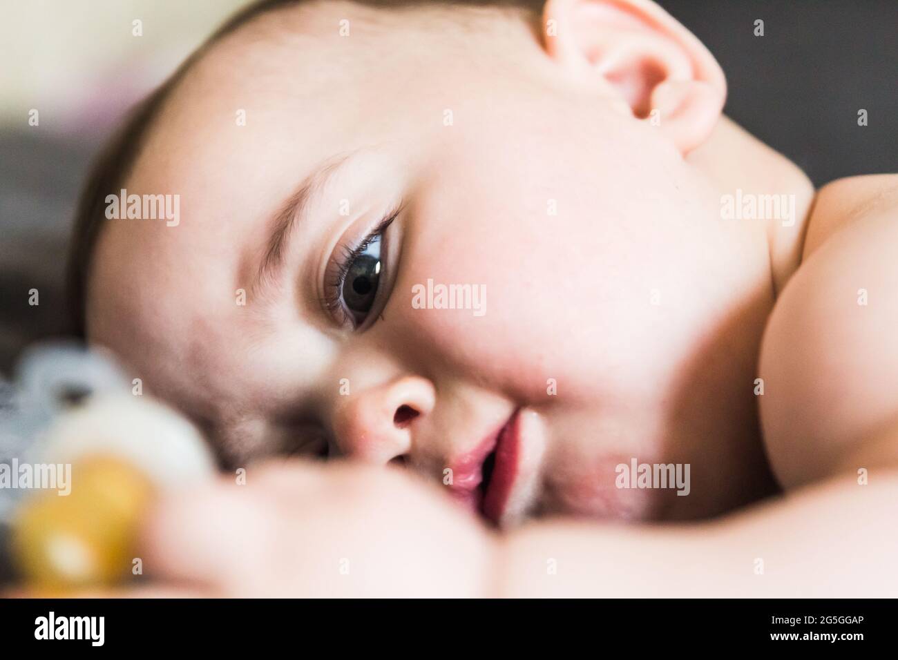 A portrait of adorable baby lying Stock Photo - Alamy