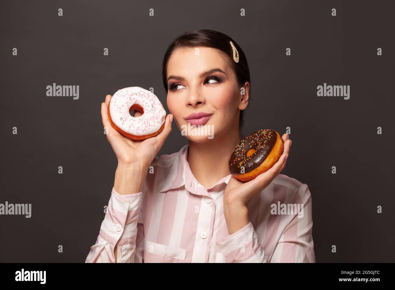 Funny young woman eating donut hi-res stock photography and images - Alamy