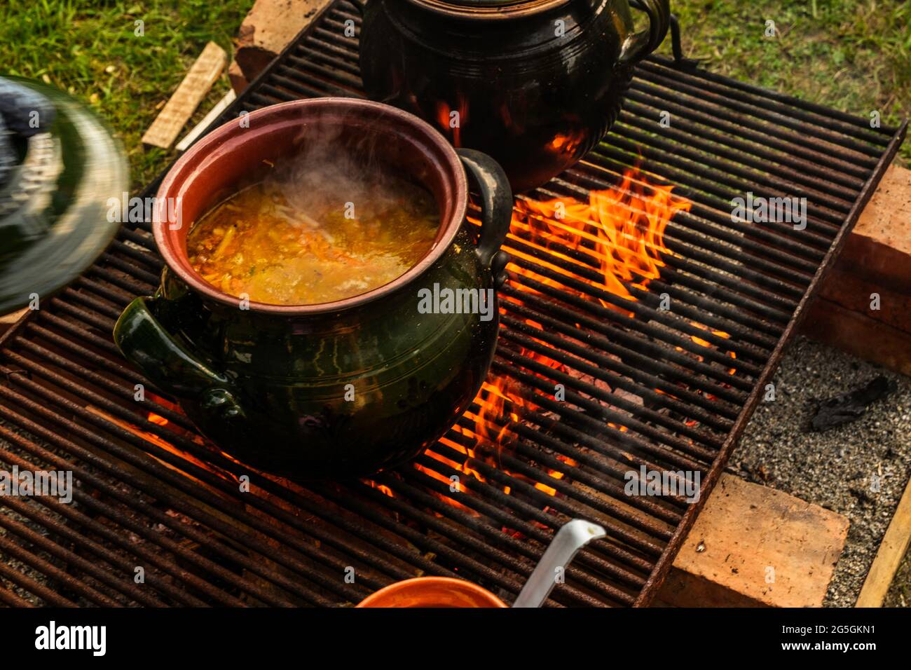 Romanian traditional food prepared at the cauldron on the open fire ...