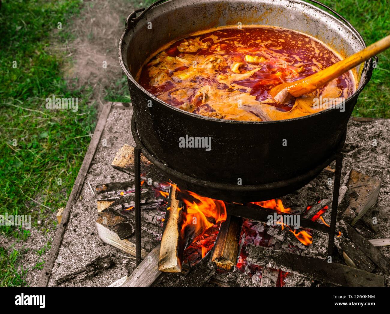 Romanian traditional food prepared at the cauldron on the open fire ...