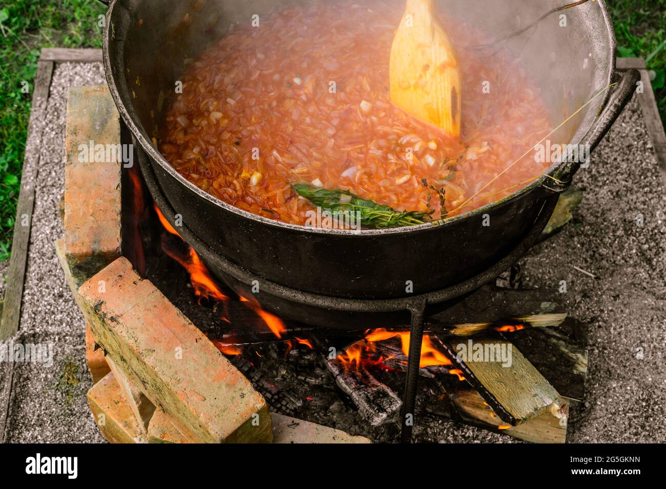Romanian traditional food prepared at the cauldron on the open fire ...