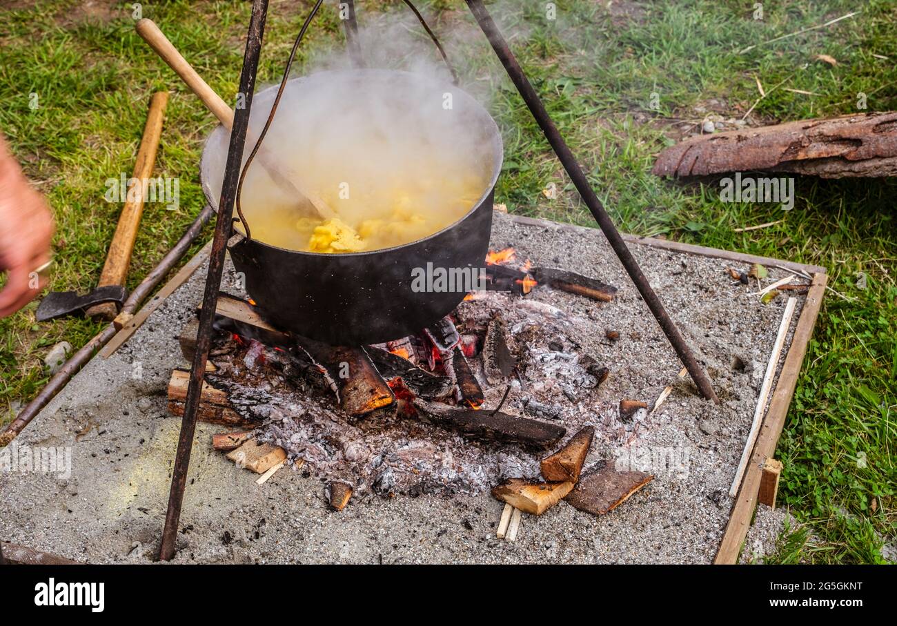 Romanian traditional food prepared at the cauldron on the open fire ...
