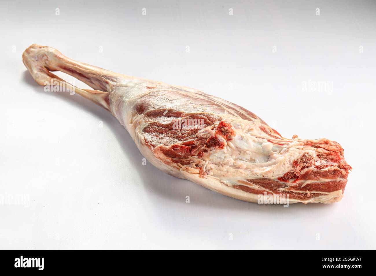 Raw lamb leg for cooking isolated Stock Photo - Alamy